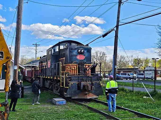 That vintage locomotive waiting at the platform looks like it stepped straight out of a classic movie scene.