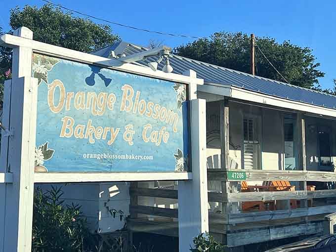 Those hand-painted flowers on the sign tell you everything about the care waiting inside this island treasure.