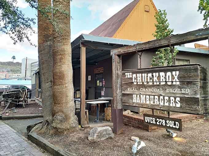 That weathered wood exterior isn't trying to look vintage&mdash;it earned every splinter through decades of burger excellence.