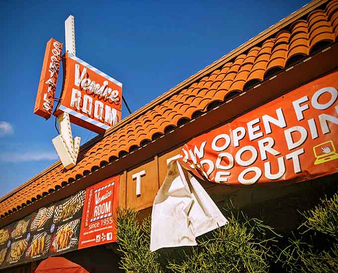 That vintage neon sign isn't just advertising, it's practically a love letter to mid-century California dining dreams.
