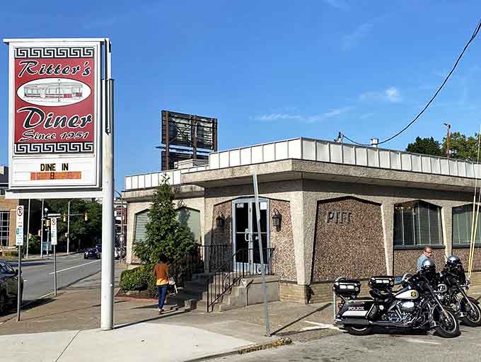 That classic sign beckons like a lighthouse for hungry souls seeking refuge from modern dining chaos.