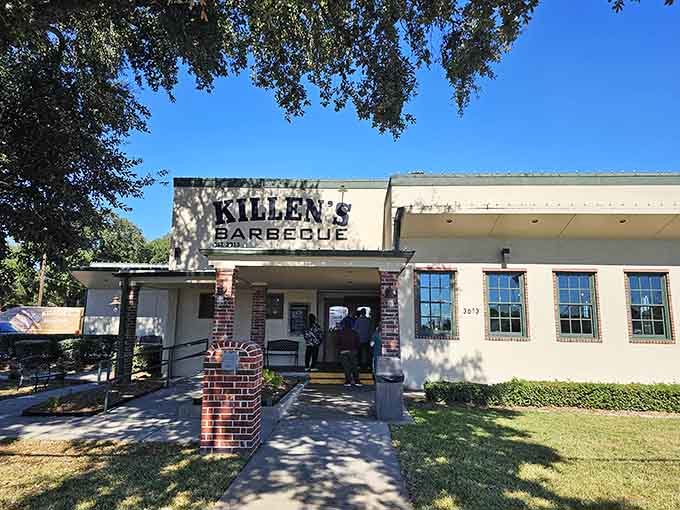 That unassuming white building with the brick columns is your gateway to barbecue enlightenment and possible meat sweats.