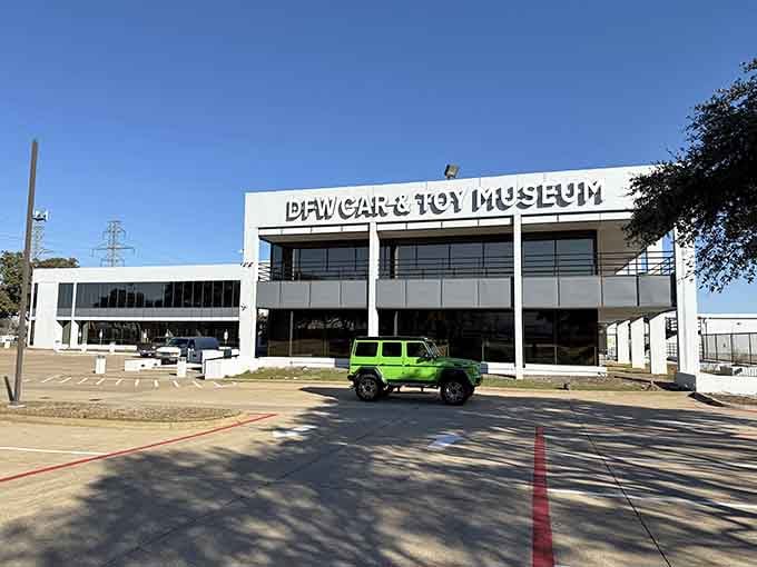 That sleek modern facade hides a treasure trove of automotive history waiting just beyond those doors.