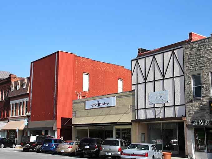 Main Street architecture mixing Tudor revival with practical Midwestern charm, where every storefront tells a century of stories.