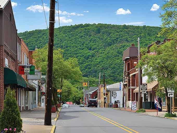Main Street Reynoldsville stretches out like a postcard from simpler times, where brick buildings still mean something.