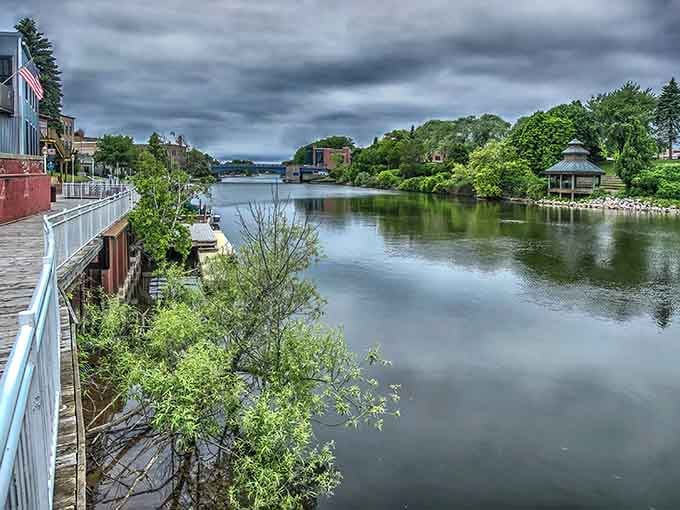 The Manistee River reflects the sky like nature's own mirror, creating double the beauty with zero effort.