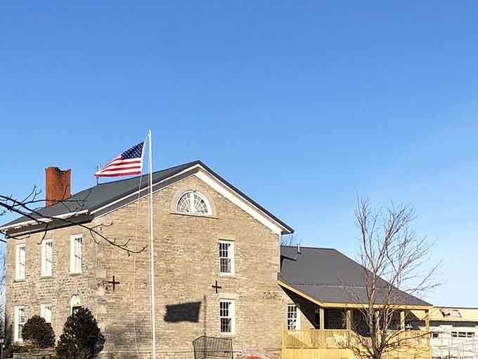 The historic stone facade tells you immediately that this isn't your typical furniture warehouse with fluorescent lights and particle board nightmares.