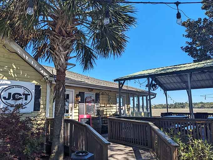 That coastal charm and covered porch seating whisper one thing: something delicious is happening inside.