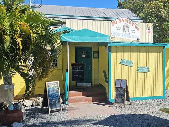 That cheerful yellow exterior with turquoise trim is your first clue you've found something wonderfully different in the Keys.
