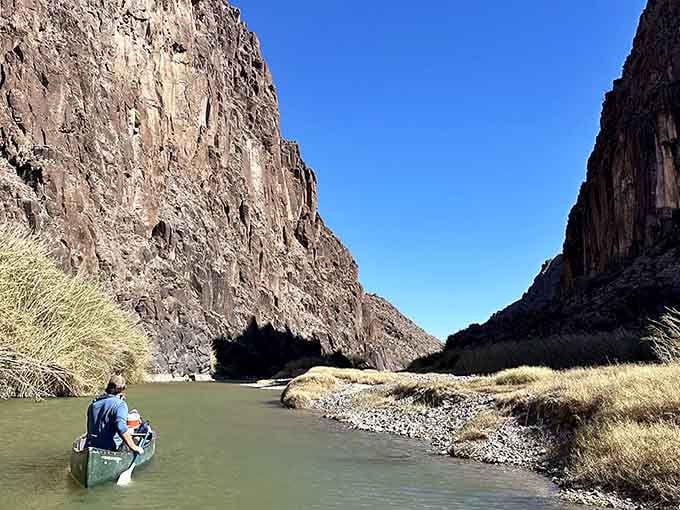 Canyon walls rise like natural skyscrapers, dwarfing everything below in this geological wonderland of epic proportions.