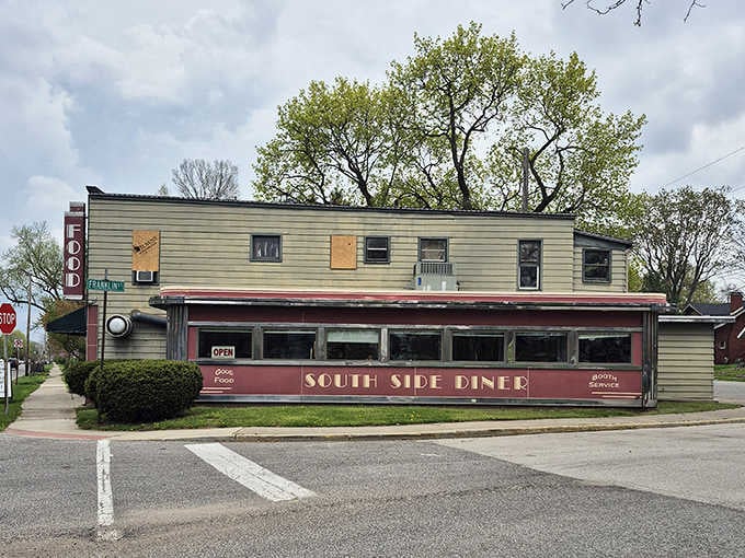 That burgundy and cream exterior isn't just a building, it's a time machine with a parking lot.
