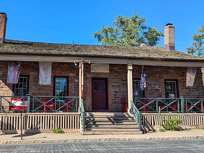 That stone facade and welcoming porch have been greeting travelers since before America had its first birthday.