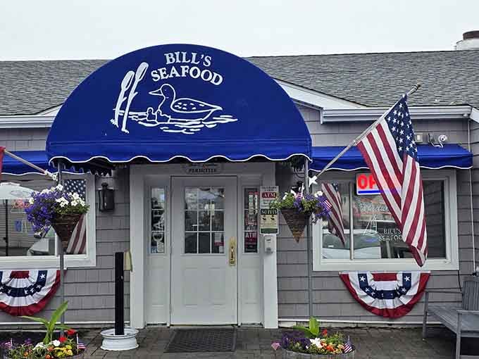 That cheerful blue awning and patriotic bunting practically shout "summer seafood paradise" before you even taste a bite.