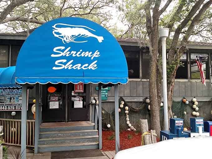 That blue awning isn't just charming, it's your beacon to some of the freshest seafood in the Lowcountry.
