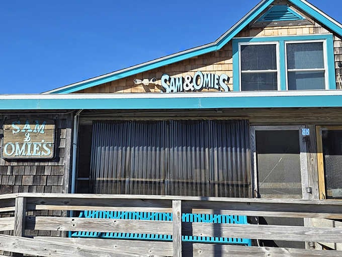 That turquoise trim against weathered shingles tells you everything: this place has stories, and they all involve seafood.