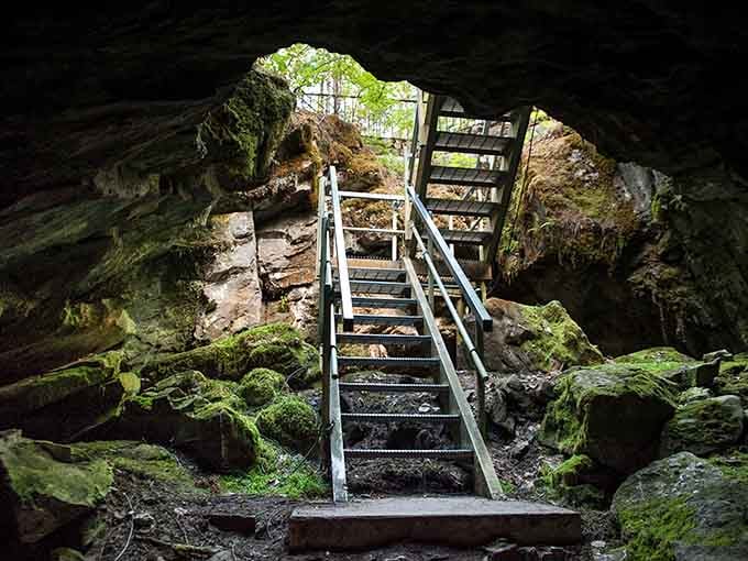 Moss-covered rocks and metal stairs create a stairway to heaven, except you're heading delightfully downward into the cool depths.