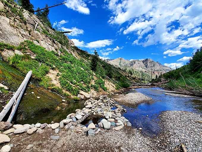 Nature's infinity pool meets mountain majesty in a scene so perfect you'll swear someone Photoshopped it.