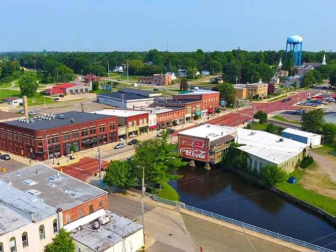 Downtown Albion from above reveals a town where historic brick buildings meet tree-lined streets and actual affordable living.