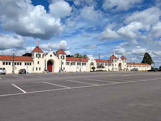Those red-tiled turrets against dramatic clouds remind you that even parking lots can have architectural personality and charm.
