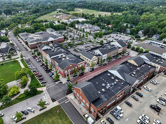 Aerial view of a thriving mixed-use development where shopping, dining, and community converge in perfect suburban harmony.