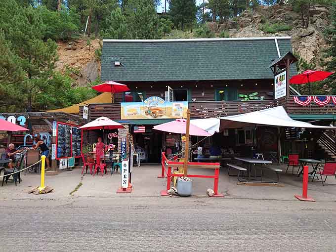 Those colorful umbrellas and red chairs signal you've found mac and cheese paradise in the mountains.