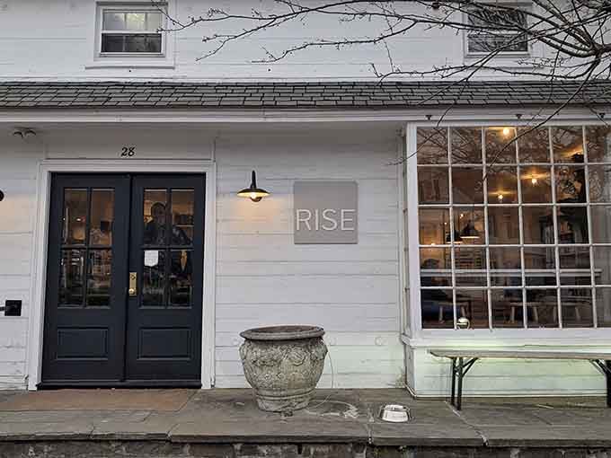 That charming white exterior isn't just pretty, it's ground zero for Connecticut's donut revolution happening daily.