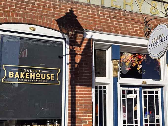 That charming brick facade and vintage lamppost tell you something special is happening behind those blue-trimmed windows.