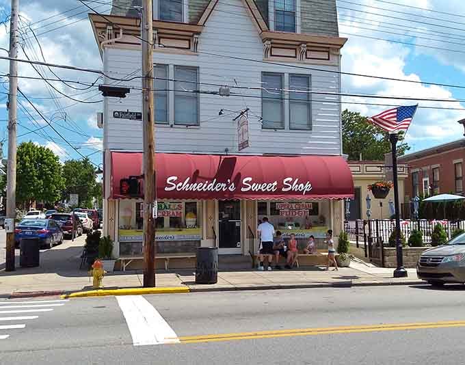 That red awning beckons like a lighthouse for sugar-seekers, promising homemade happiness just beyond the door.