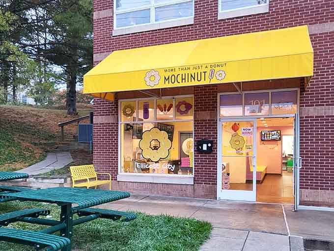 That cheerful yellow awning beckons like a beacon of fried dough happiness in Ellicott City's landscape.