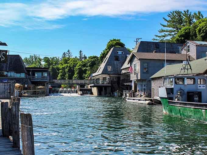 The shanties huddle along the river like old friends sharing stories, weathered but standing strong after generations.