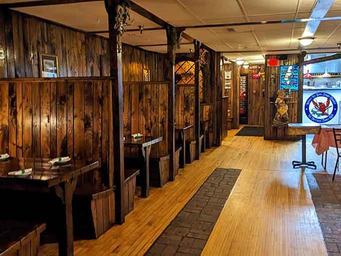 Wood paneling and intimate booths create that perfect neighborhood spot vibe where Louisiana meets Lake Superior beautifully.