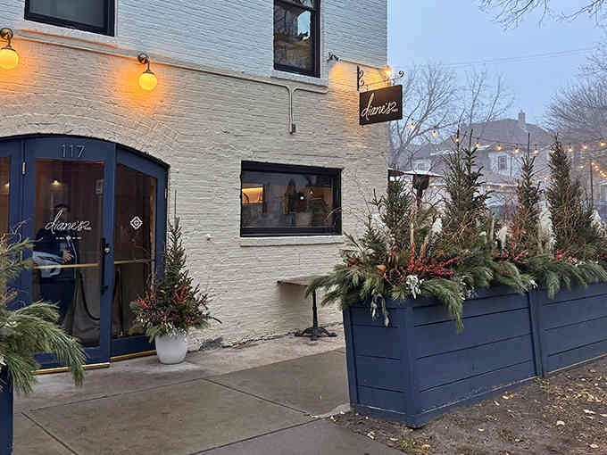 When the sun sets and those globe lights start glowing, you know something magical is about to happen behind that charming facade.