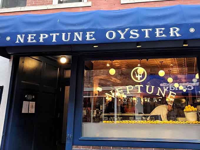 That blue awning beckons like a lighthouse for seafood lovers, promising treasures from the deep inside.