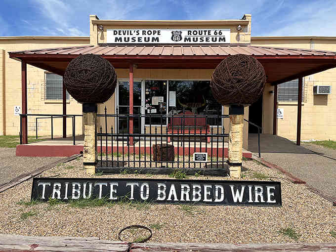 Those giant barbed wire spheres flanking the entrance aren't just decoration, they're a promise of wonderfully weird things ahead.