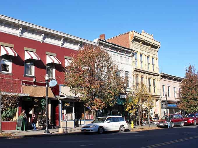 Historic brick buildings line streets where every storefront tells a story worth discovering on foot.