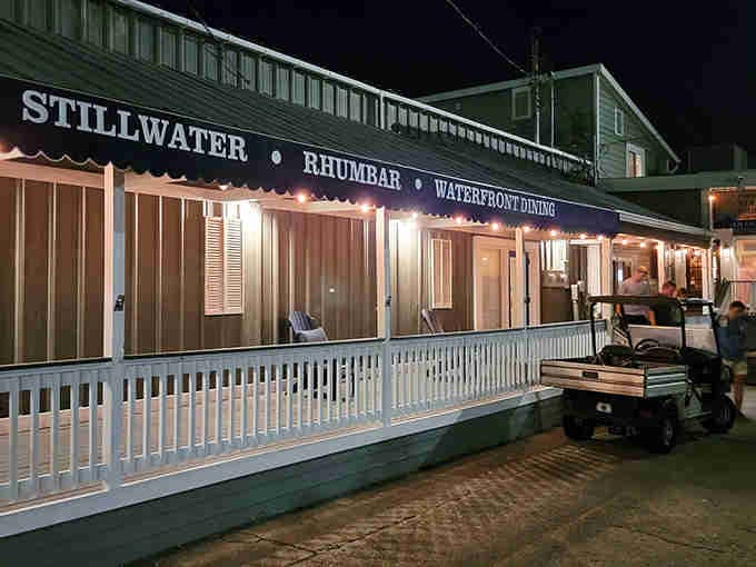 That classic coastal charm hits different when it's lit up at night and promising Caribbean flavors inside.