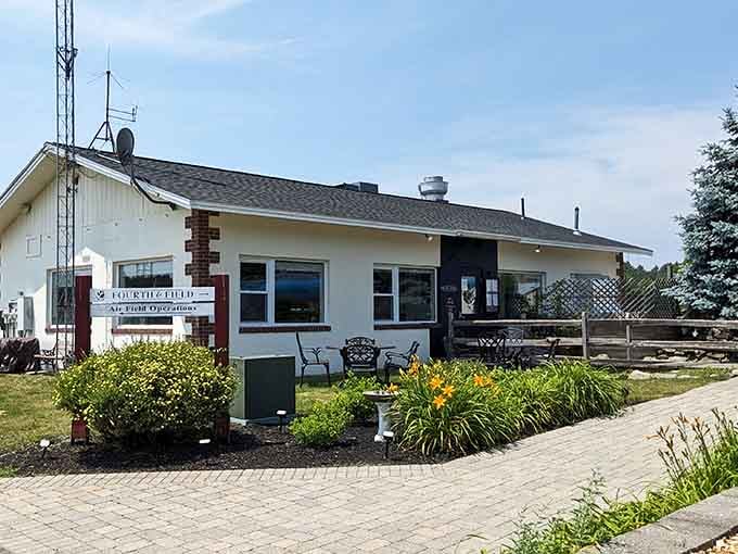 Classic New England charm meets aviation dreams at this cream-and-brick beauty that's redefining airport dining expectations completely.