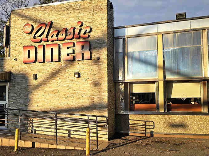 Morning light hits The Classic Diner like a movie set, promising breakfast adventures behind those welcoming windows and doors.