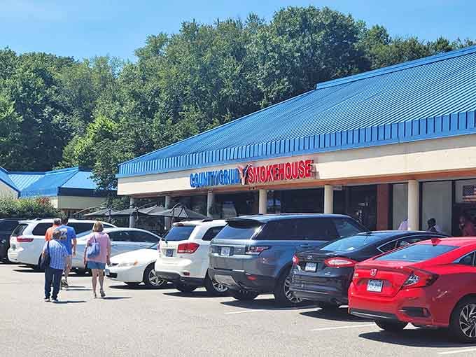 That blue roof and bold red lettering aren't just calling you in, they're practically demanding you pull over for some serious barbecue.