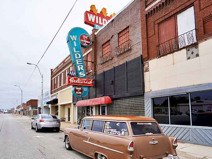 That neon sign has been calling hungry souls to Main Street longer than most GPS systems have existed.