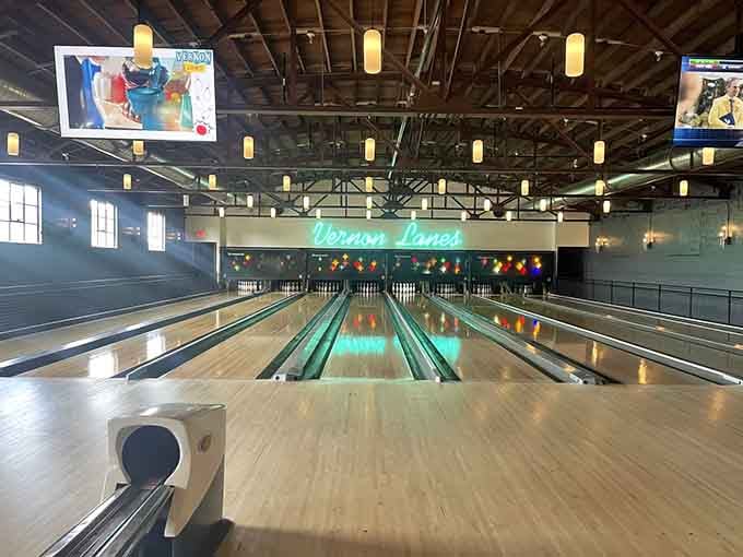 Those gleaming lanes stretch toward infinity like a highway to happiness, complete with vintage neon dreams overhead.