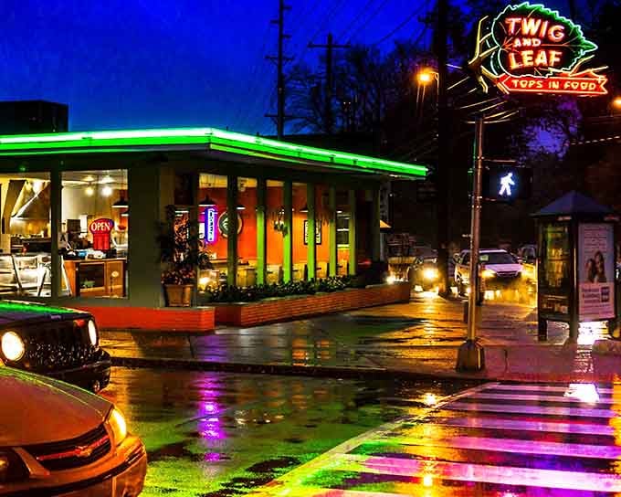 That green neon glow reflecting off wet pavement looks like something straight out of American Graffiti, only better.