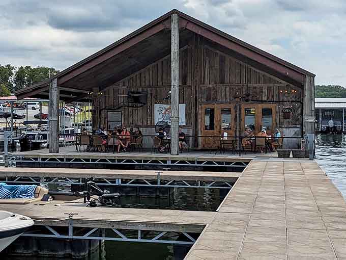 That weathered dock leading to rustic charm is your first clue you've found something genuinely special on the water.