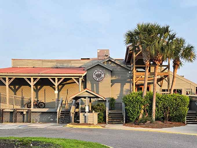 That weathered wood and those swaying palms practically whisper "fresh seafood" before you even step inside.
