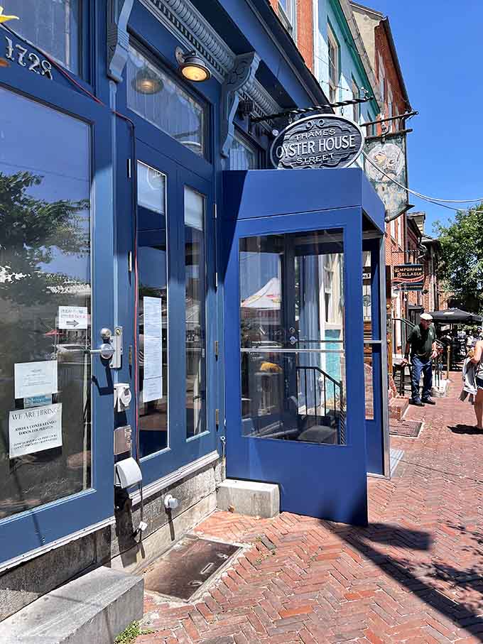 That cheerful blue facade isn't just pretty, it's basically a lighthouse guiding hungry seafood lovers to salvation.