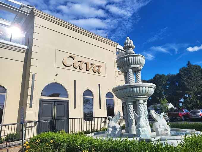 The cream facade whispers sophistication while the sculptural fountain out front practically shouts "adventure starts here, folks."