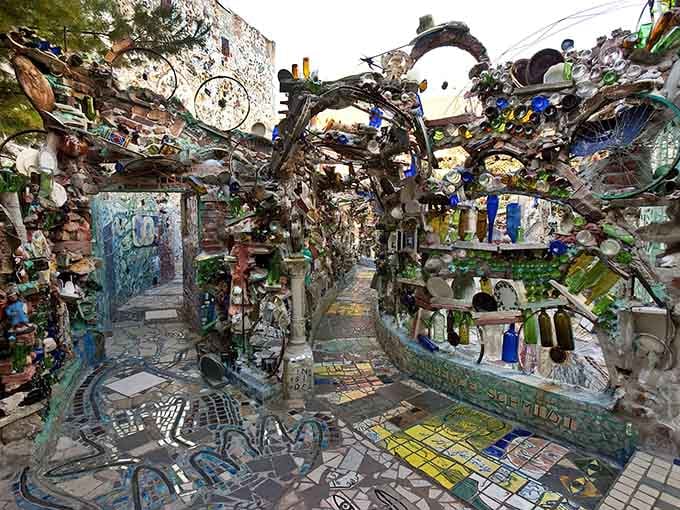 Every surface tells a story in broken tiles and found treasures, like a three-dimensional scrapbook designed by a genius.