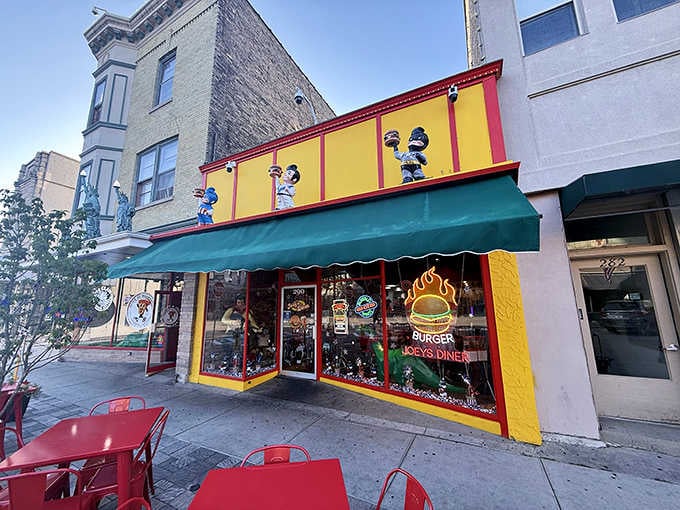 That yellow and red exterior isn't whispering for your attention, it's practically doing a cheerleader routine from the sidewalk.