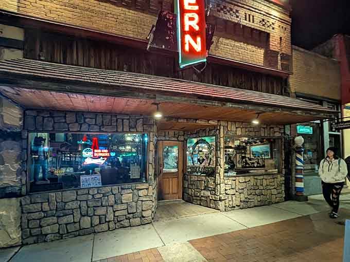 That stone facade and wooden entrance aren't just for show—they're your portal to an era when disputes were settled with six-shooters instead of strongly worded emails.