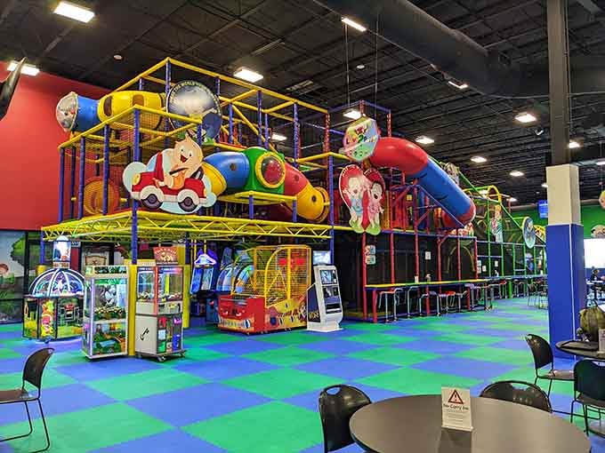 That towering play structure isn't just impressive, it's basically a colorful skyscraper designed for maximum childhood joy.